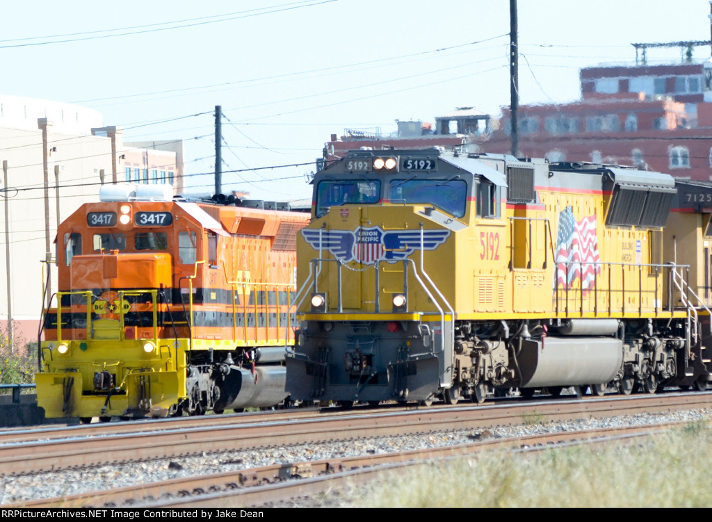 UP 51912 DGNO 5192, both awaiting traffic at Cadiz St.